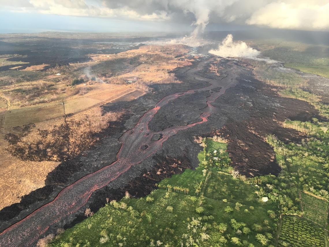 How does HVO determine which regions are most threatened by lava flows?